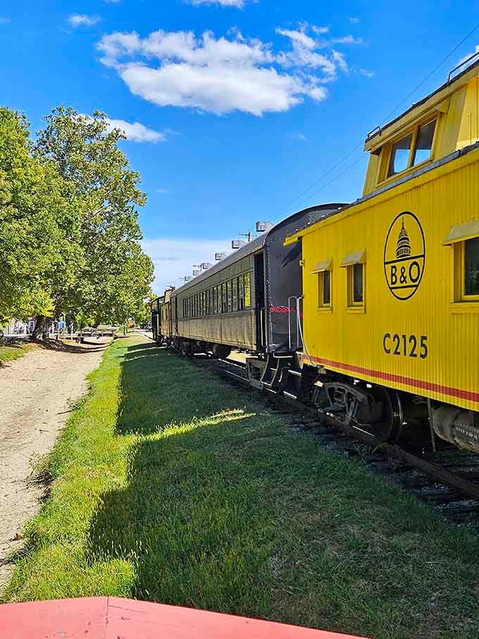 That cheerful yellow caboose isn't just for show; it's your ticket to a slower, sweeter way of seeing Indiana.