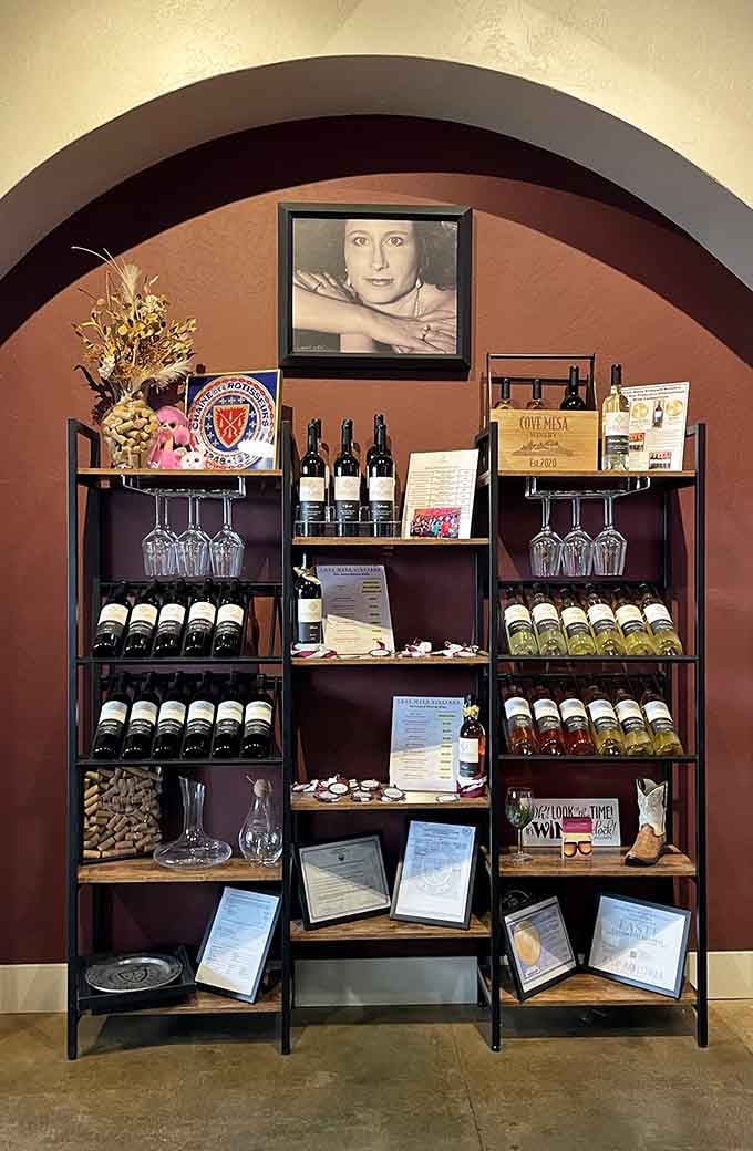 Awards, bottles, and a portrait on the wall, this display tells you everything about how much heart goes into every pour.