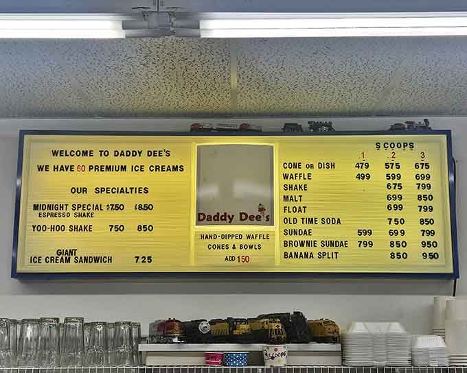 A glowing yellow menu board with banana splits, malts, and old-time sodas &mdash; this is nostalgia you can actually order.