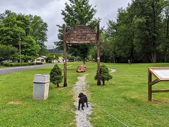 Even the dog knows this Appalachian Trail welcome sign is worth stopping for in Damascus, Virginia.