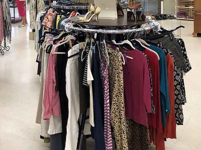 Circular racks packed with colorful clothing, proof that someone else's closet cleanout is your wardrobe upgrade.