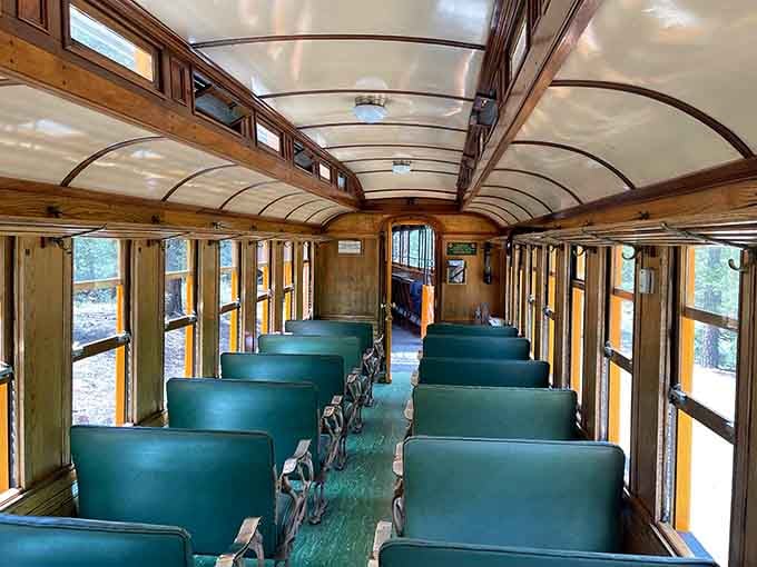 Warm wood, green seats, arched ceilings, stepping inside this car feels like time travel done right.