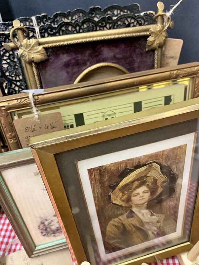 Gold frames and vintage portraits lean together like old friends who've been waiting for someone to notice them.