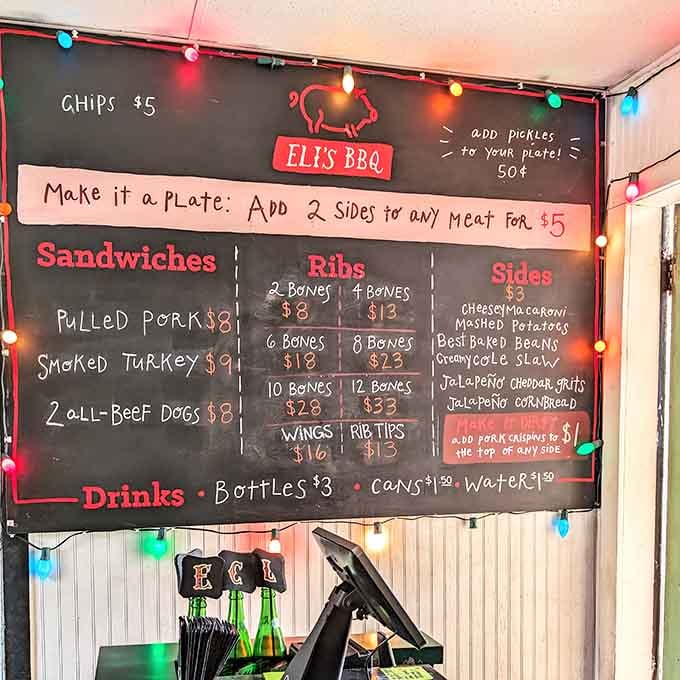 A chalkboard menu lit by colorful string lights, pulled pork, ribs, and jalape&ntilde;o cheddar grits all in one glorious place.