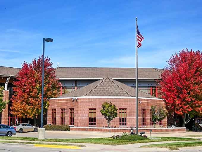Those brilliant red trees flanking the library create a fall spectacle that rivals any New England postcard scene.