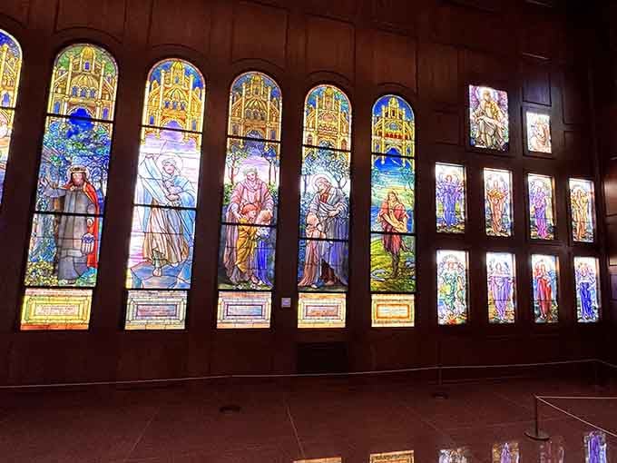 Rows of towering windows line the walls, each one telling a story older than anyone in the room.