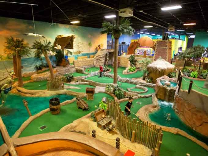 This isn't your grandpa's putt-putt. Grand Slam's tropical mini golf course is genuinely jaw-dropping, palm trees and all.