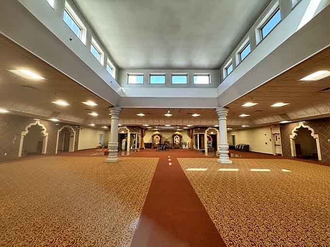 Elegant white columns and richly patterned carpets lead your eyes straight toward something truly sacred and beautiful.