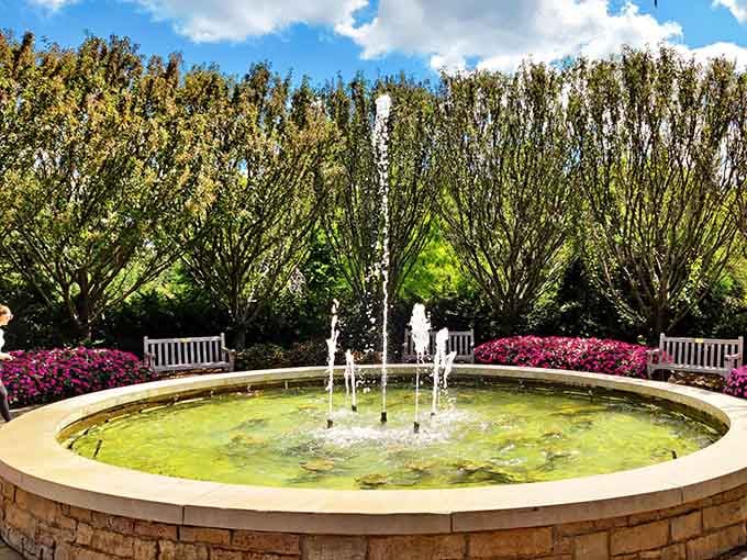 This fountain doesn't just splash around. It puts on a full performance, and the white benches are the best seats in the house.