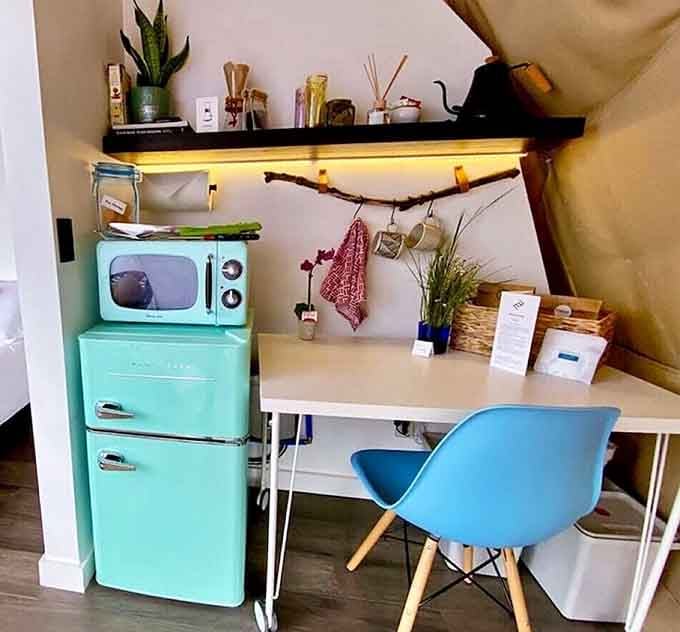 That turquoise retro fridge is so charming it almost makes you forget you're on a hillside in Texas.