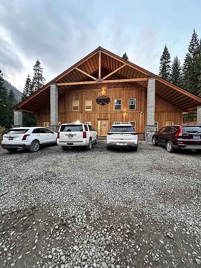 Warm timber beams, stone columns, and glowing lights at dusk make this lodge look like a dream you don't want to wake from.