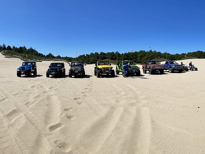 A lineup of colorful Jeeps on the dunes, because sometimes the beach needs a little horsepower to feel complete.