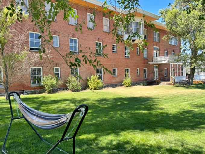 A hammock, green grass, and a century-old brick wall. Your afternoon plans just wrote themselves.