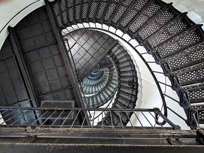 Looking up through this spiral staircase feels like staring into a beautiful, slightly terrifying iron dream.