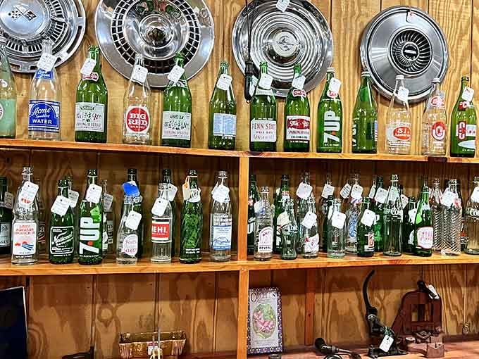 Chrome hubcaps and vintage bottles transform ordinary shelves into displays worthy of your Instagram feed, honestly.