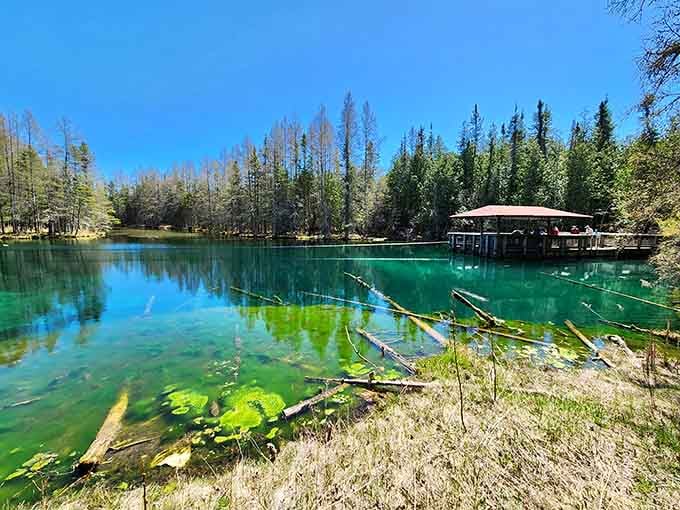 The raft dock sits ready, because some natural wonders deserve a front-row seat, not just a shoreline glance.