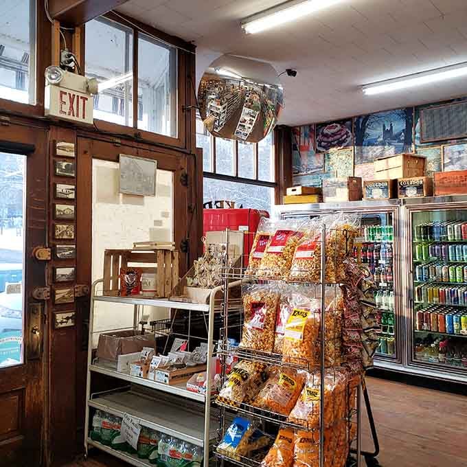 Flavored popcorn stacked high and a cooler full of craft drinks. Road trip snacks, sorted.
