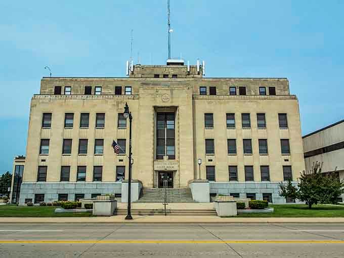 The Marinette County Courthouse stands like a stern but fair uncle, all clean Art Deco lines and no-nonsense limestone authority.