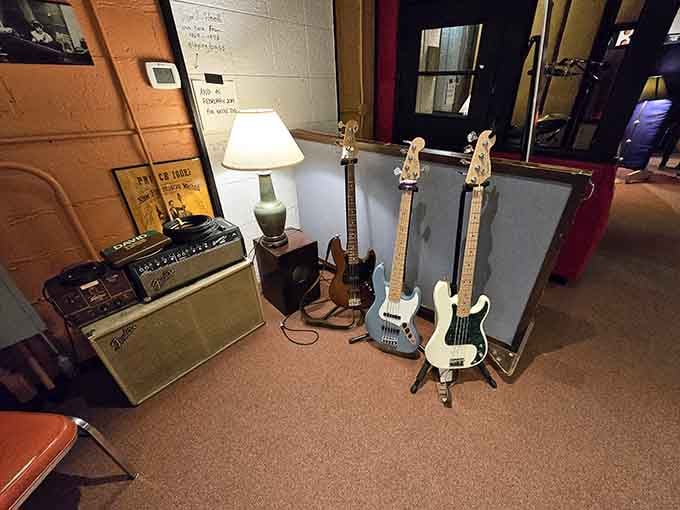 Guitars leaning against the wall, amps at the ready. Somebody important played through that Fender, and you can feel it.