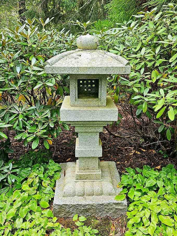 This stone lantern has been standing quietly in the greenery long before anyone thought to photograph it.