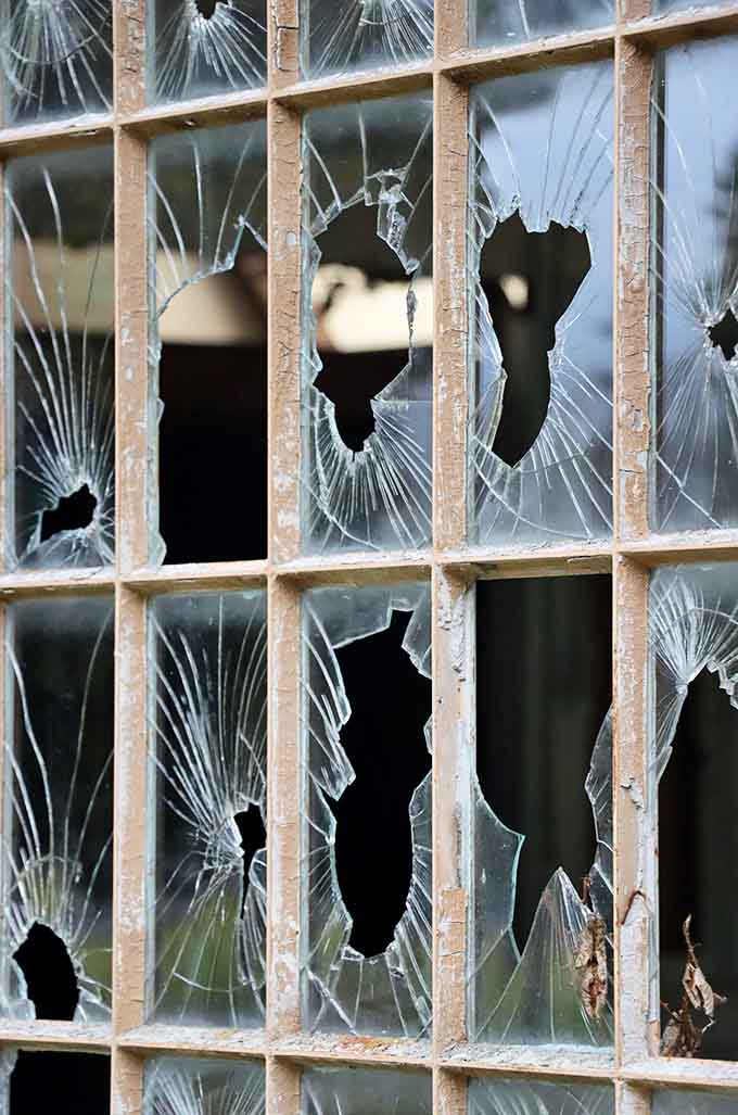 Every shattered pane here is a small, jagged reminder that some things simply cannot be kept contained forever.
