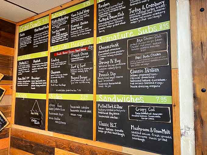 This menu board proves someone decided mediocrity wasn't an option, offering everything from French Dip to Shrimp Po' Boy at a fuel stop.