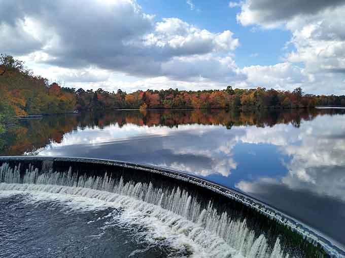 When the spillway meets fall foliage, even your phone camera feels like it's having the best day of its life.