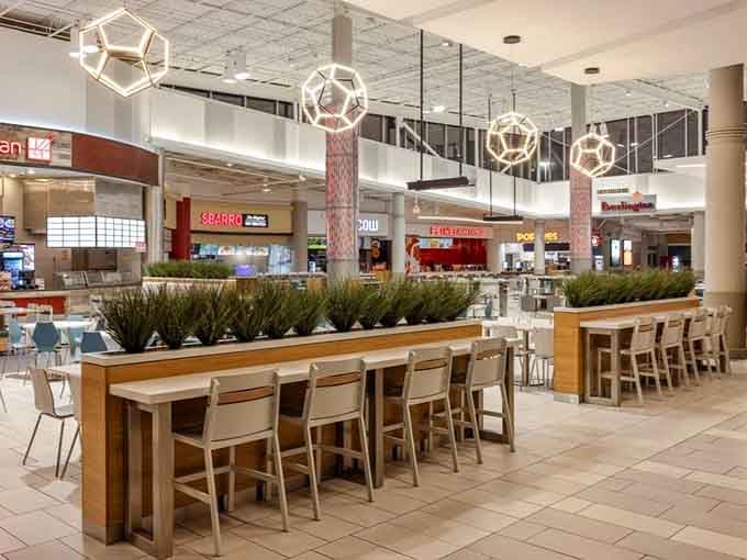 Modern food court design meets your midday refueling needs with geometric lighting and communal seating.