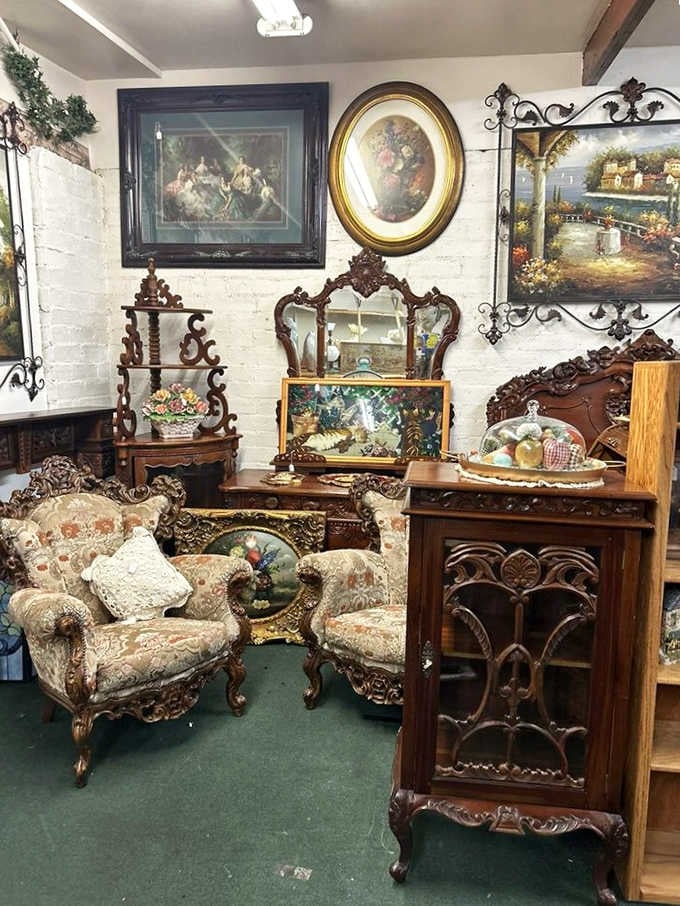 Ornately carved Victorian armchairs and gilded oil paintings that belong in a manor house, somehow available in Beaumont.