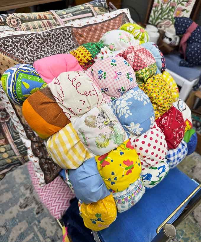 Somebody's grandmother made this patchwork puff pillow with love, and now it's ready to brighten up your living room.