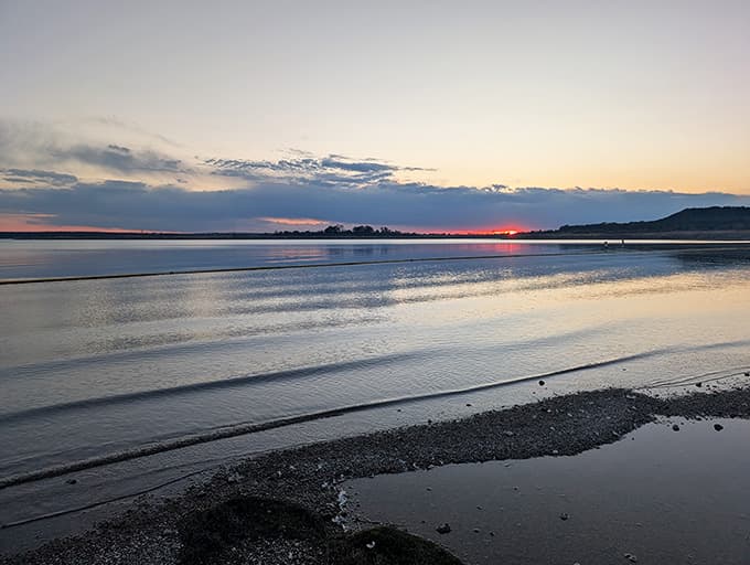 Sunset paints the still waters in colors so soft you'd swear someone dimmed the lights on purpose.