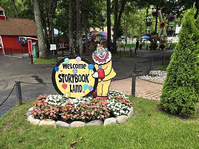 A cheerful clown welcomes you in, with rides and red barns visible beyond, promising a genuinely wonderful afternoon ahead.