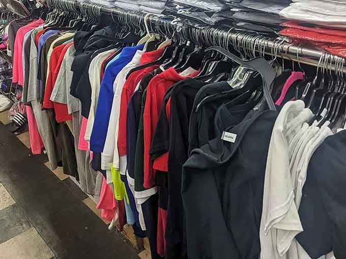 Row after colorful row of clothing, packed tight and bursting with variety, like a rainbow decided to open a shop.