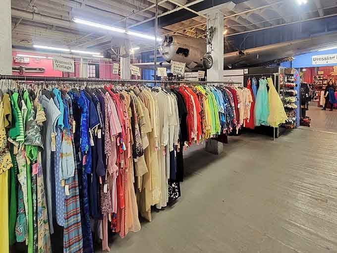 Color-coded racks stretching into the distance make shopping feel like you're walking through a fashion rainbow with endless possibilities.