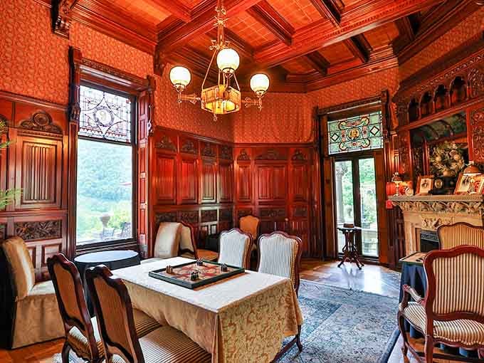 Rich wood paneling, stained glass windows, and a fireplace that means business. This room doesn't mess around.