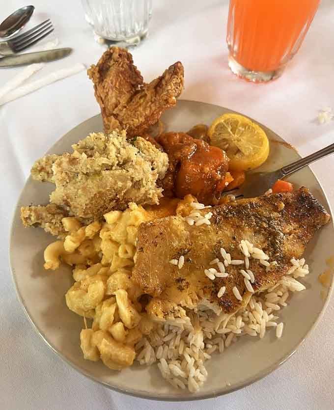 Fried chicken, seasoned fish, mac and cheese, and fried okra all on one plate, Southern cooking doesn't apologize for being generous.
