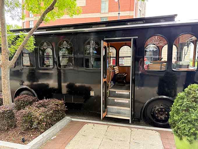 Step right up, the warm wooden steps and arched windows are your first clue that something special awaits inside.
