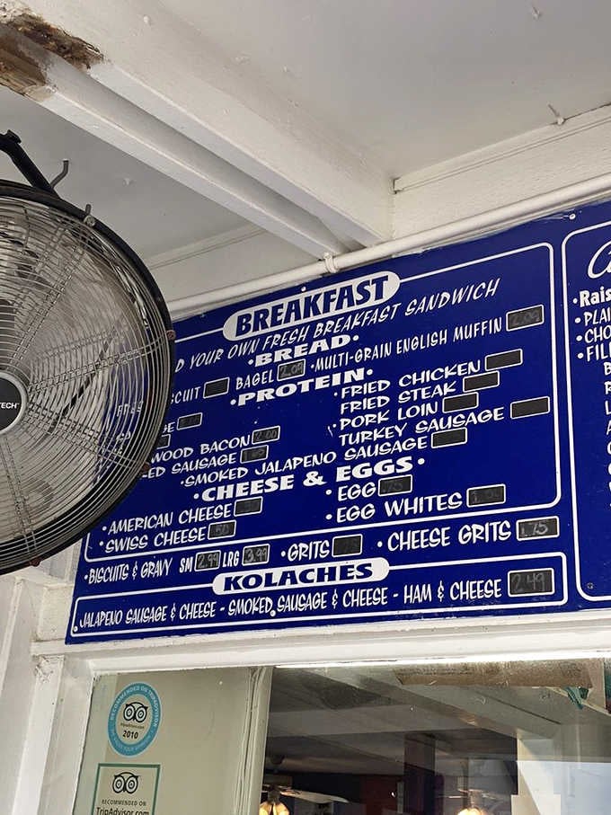 A menu board that means business, with kolaches, biscuits, and breakfast sandwiches all fighting for your attention.