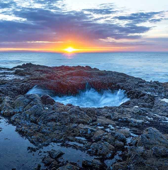Sunset at Thor's Well turns the ocean into liquid gold before it vanishes into the void.