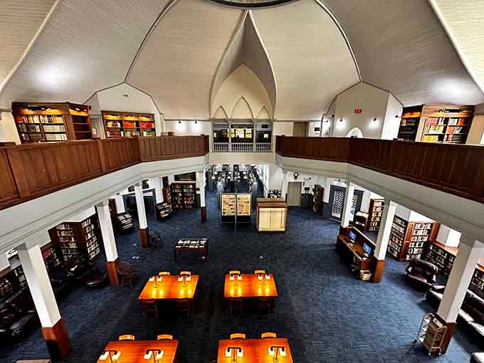 Gothic arches and reading tables create a space where Harry Potter would feel completely at home studying.