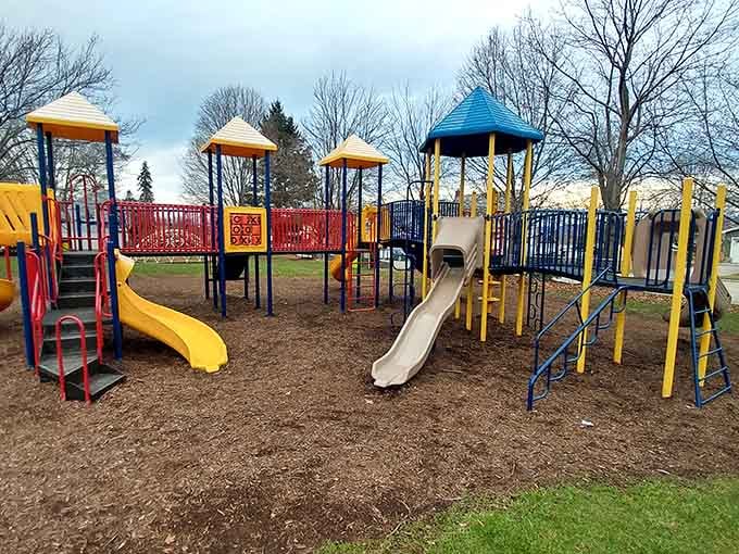 Colorful playground equipment where kids can still be kids, climbing and sliding without helicopter parents hovering every second.