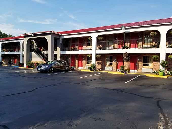 Red doors, hanging flower baskets, and a two-story layout that says "comfortable night's rest" without overcomplicating things.