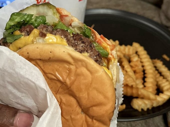 Look at that perfectly melted cheese and fresh toppings nestled in a toasted bun begging to be devoured.