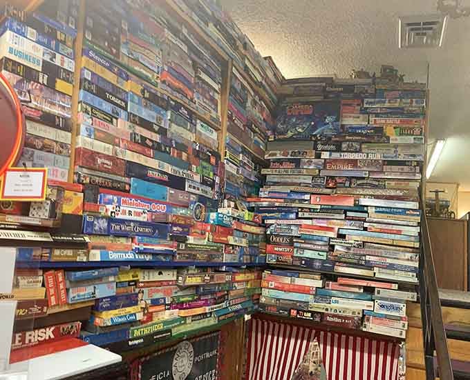 Board games stacked floor to ceiling at the World's Largest Toy Museum Complex. Somewhere in there is your childhood Saturday afternoon.