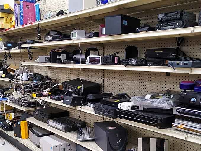 Rows of electronics waiting for second chances&mdash;someone's abandoned printer could become your office hero for pocket change.