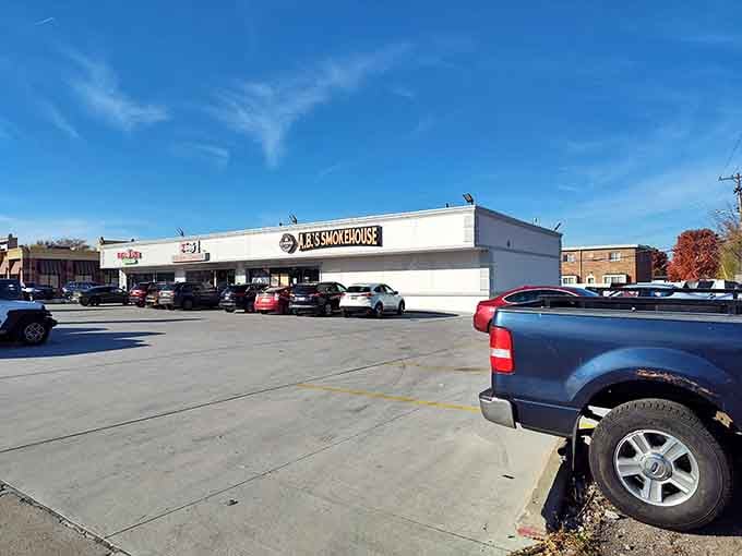 A full parking lot on a sunny afternoon is the universal sign of outstanding smoked meats waiting inside.