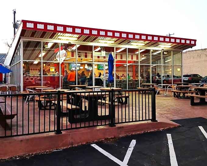 Warm golden light spills through those glass walls at dusk, making Boulevard Burger and Brew look impossibly inviting.