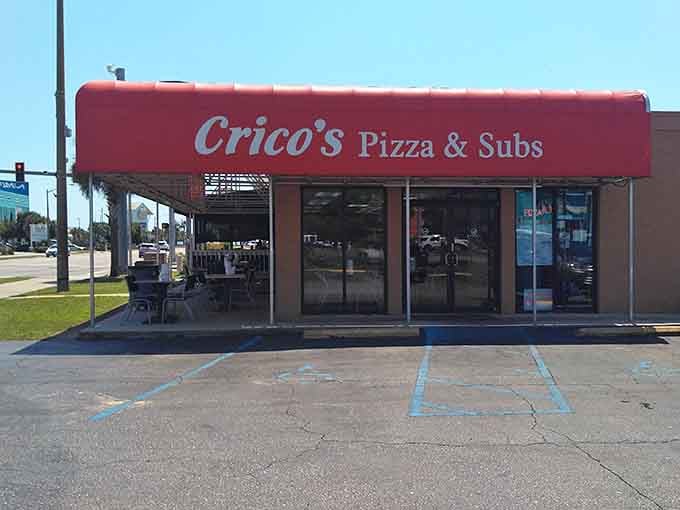 That bold red awning on Gulf Shores Parkway is basically a stop sign for anyone who loves great pizza.