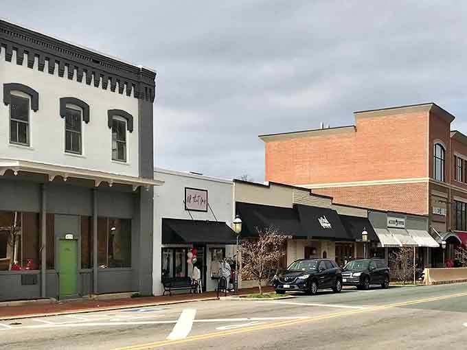 Elon's downtown wears its overcast sky like a cozy sweater, with black awnings and a bright green door stealing the show.