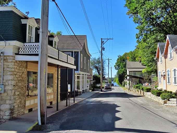 Elsah's narrow lane winds gently toward the Mississippi, flanked by stone buildings that have seen more history than most textbooks cover.